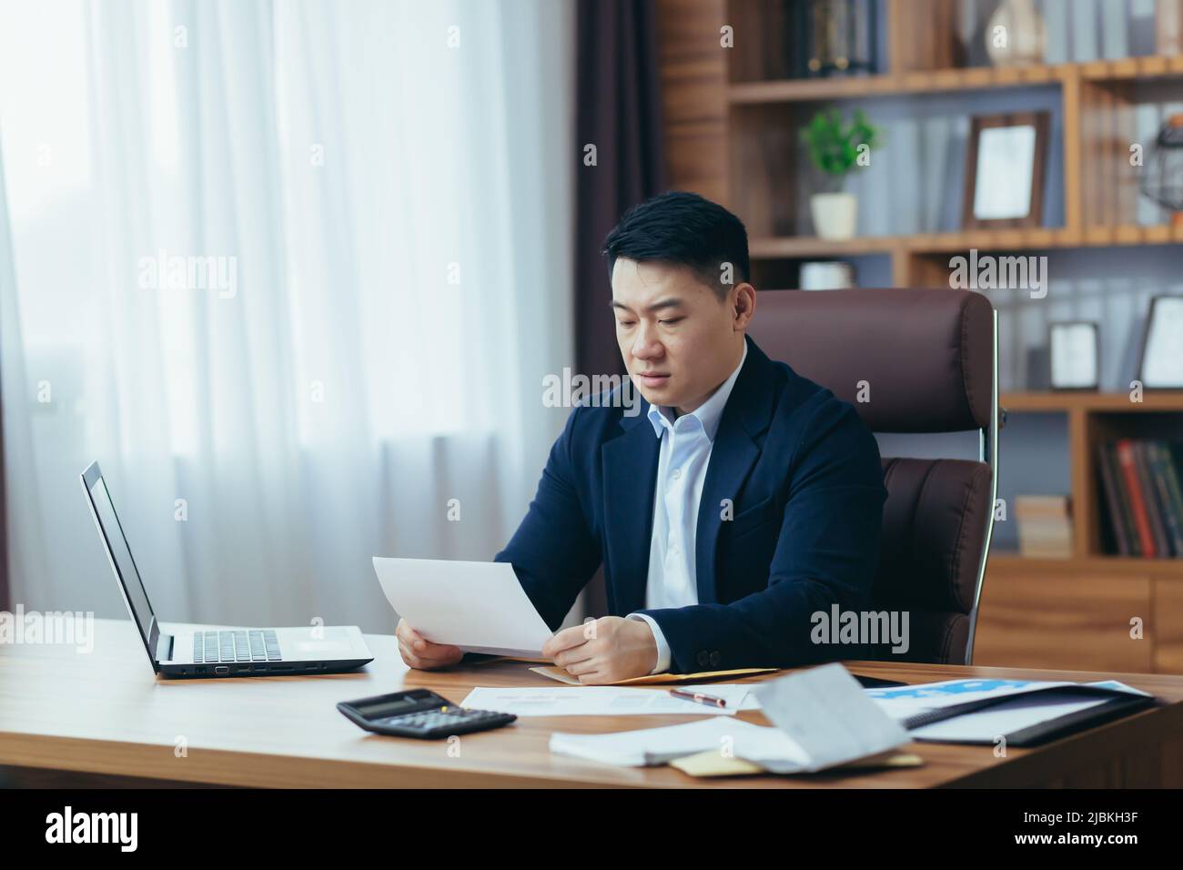 Accountant-auditor works in a classic office, calculates financial ...