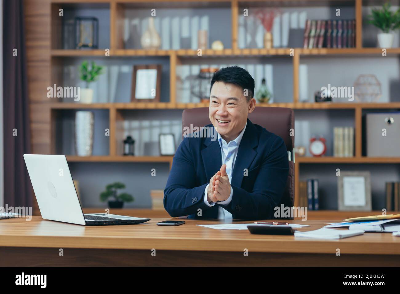Happy businessman celebrates the conclusion of a successful contract ...