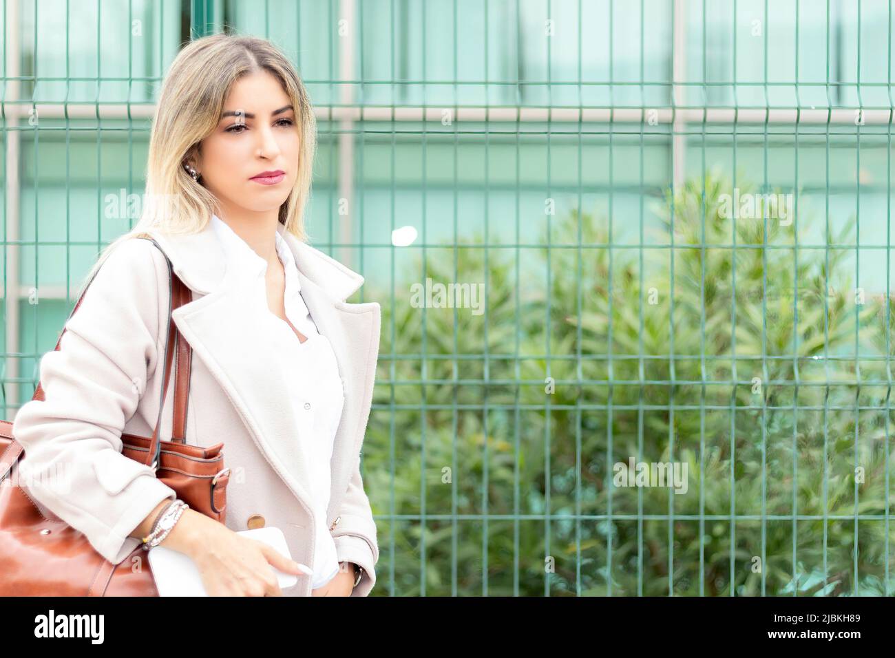 woman walking to work in a business area of a city Stock Photo - Alamy