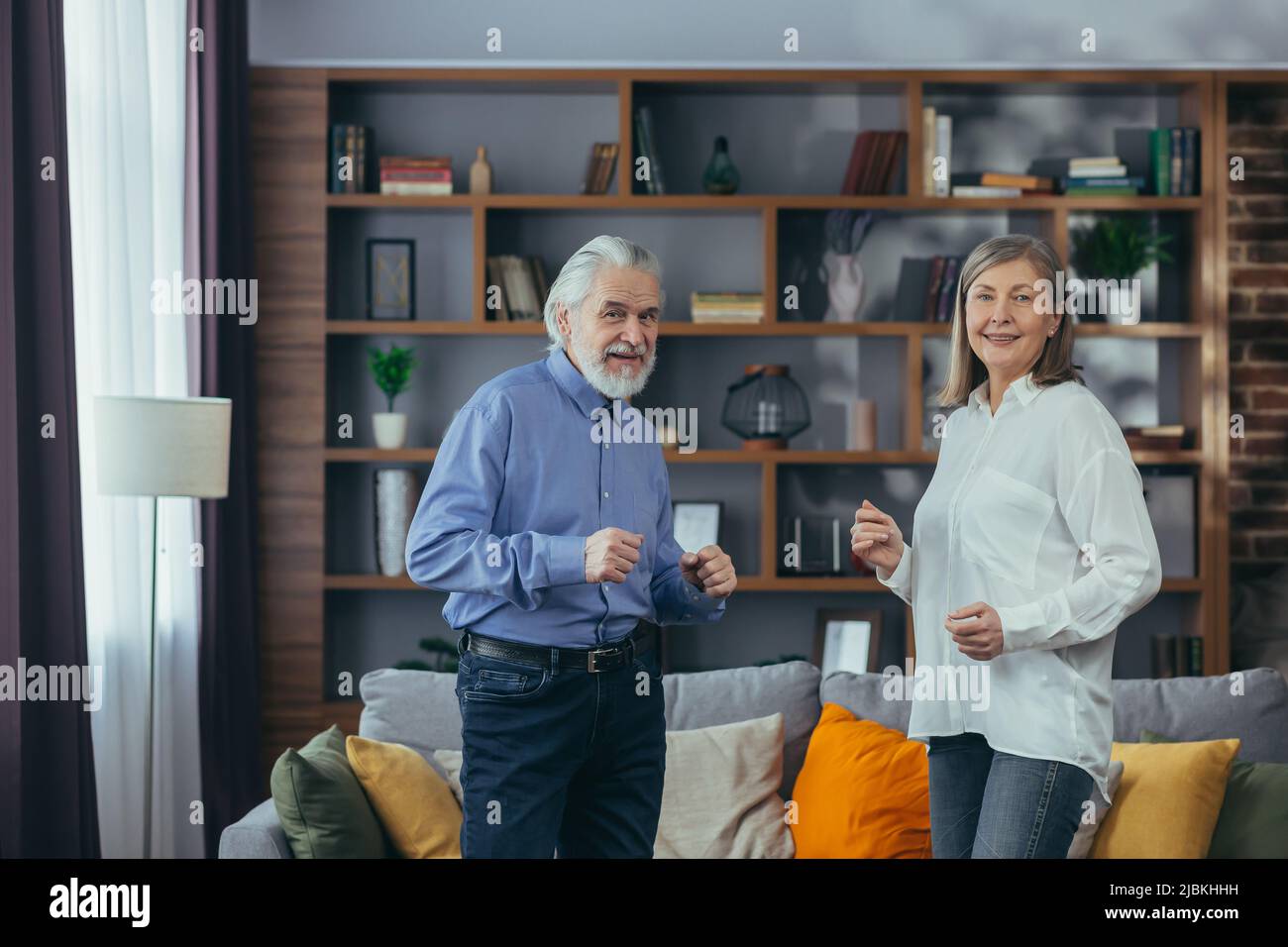 Happy cheerful senior married couple having fun at home. older family ...
