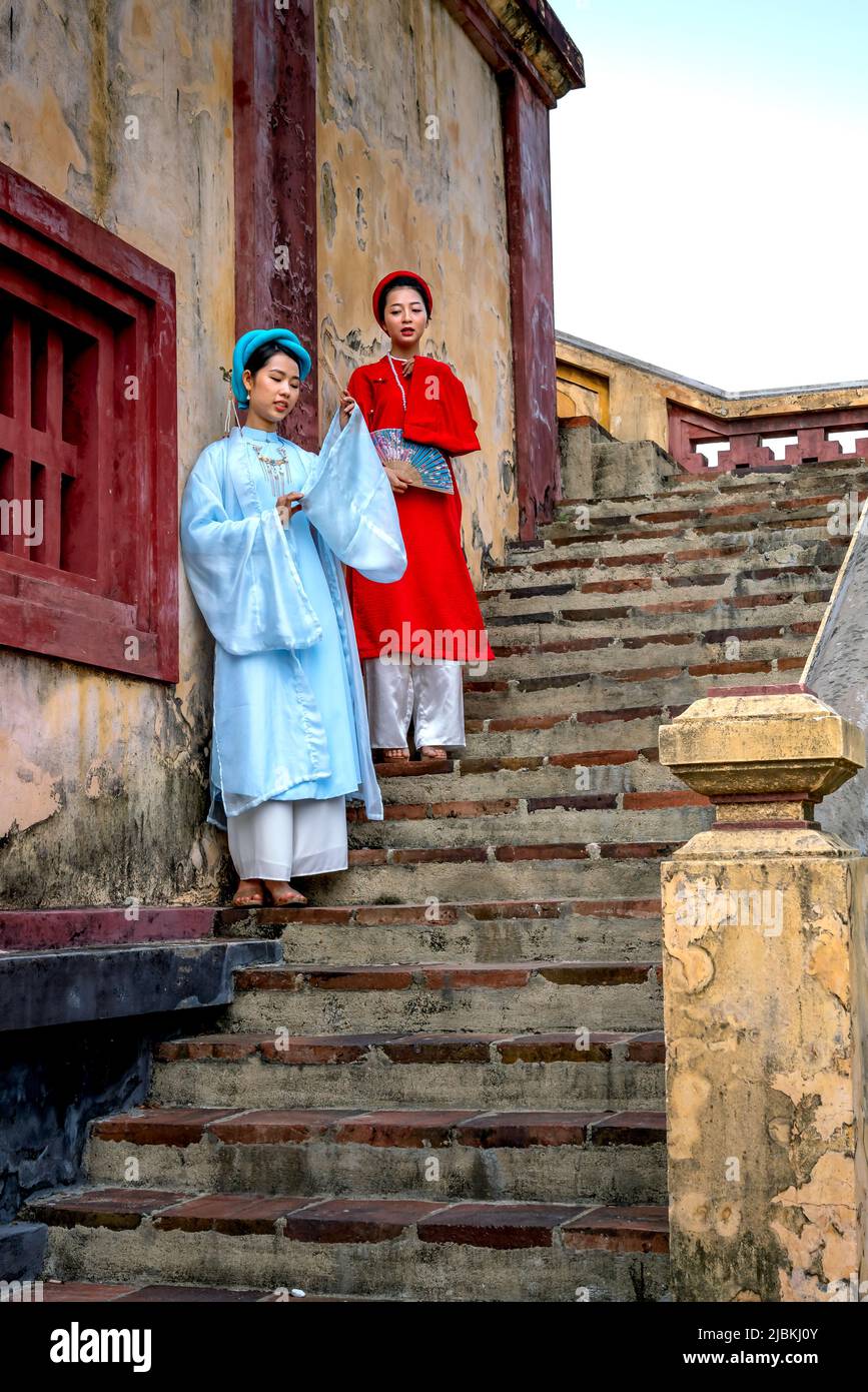 Ancient Museum, Hue City, Vietnam - April 27, 2022: Model wears a ... Ancient Museum, Hue City, Vietnam - April 27, 2022: Model wears a ...