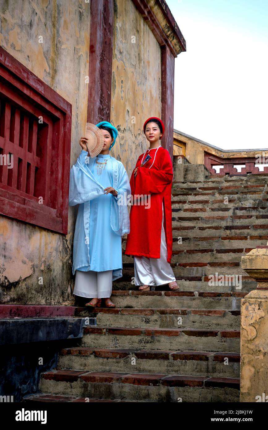 Ancient Museum, Hue City, Vietnam - April 27, 2022: Model wears a ... Ancient Museum, Hue City, Vietnam - April 27, 2022: Model wears a ...