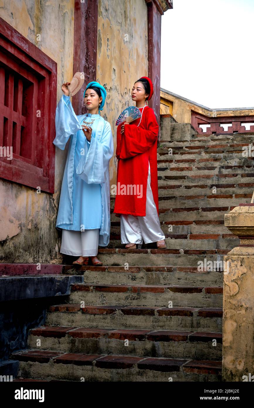 Ancient Museum, Hue City, Vietnam - April 27, 2022: Model wears a ... Ancient Museum, Hue City, Vietnam - April 27, 2022: Model wears a ...