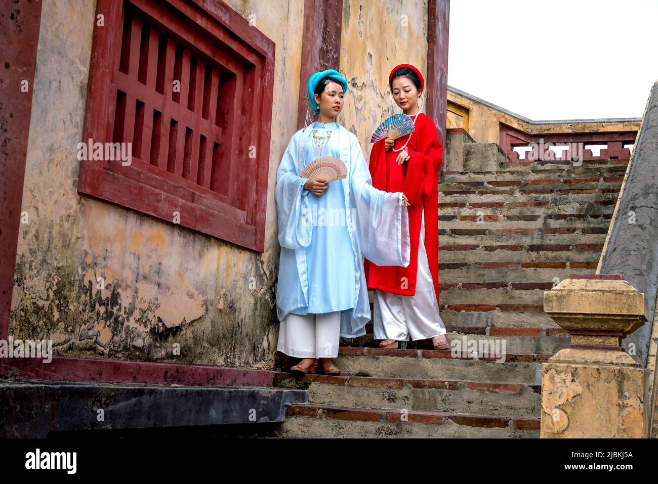 Ancient Museum, Hue City, Vietnam - April 27, 2022: Model wears a ... Ancient Museum, Hue City, Vietnam - April 27, 2022: Model wears a ...