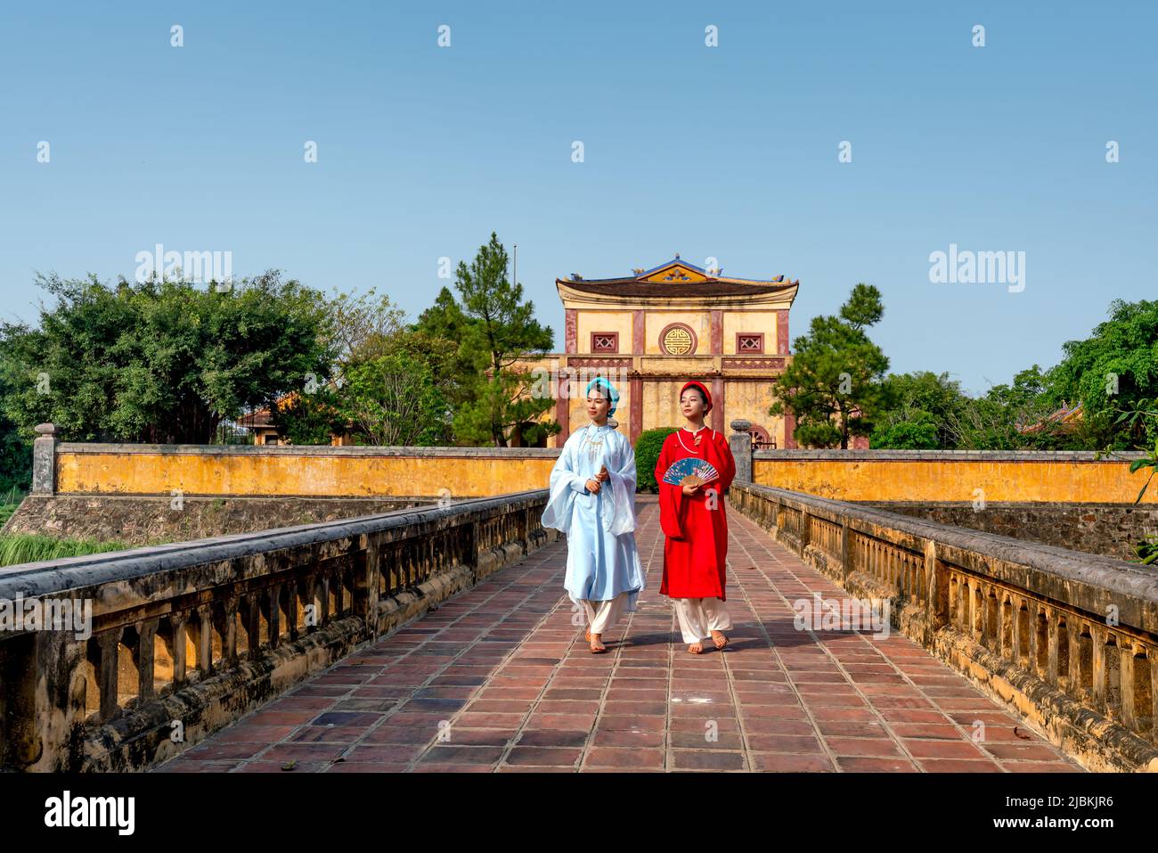 Ancient Museum, Hue City, Vietnam - April 27, 2022: Model wears a ... Ancient Museum, Hue City, Vietnam - April 27, 2022: Model wears a ...