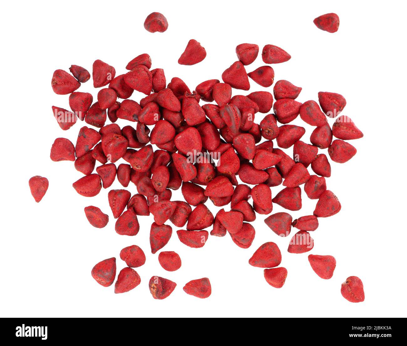 Annatto seeds, isolated on a white background. Achiote seeds, bixa ...