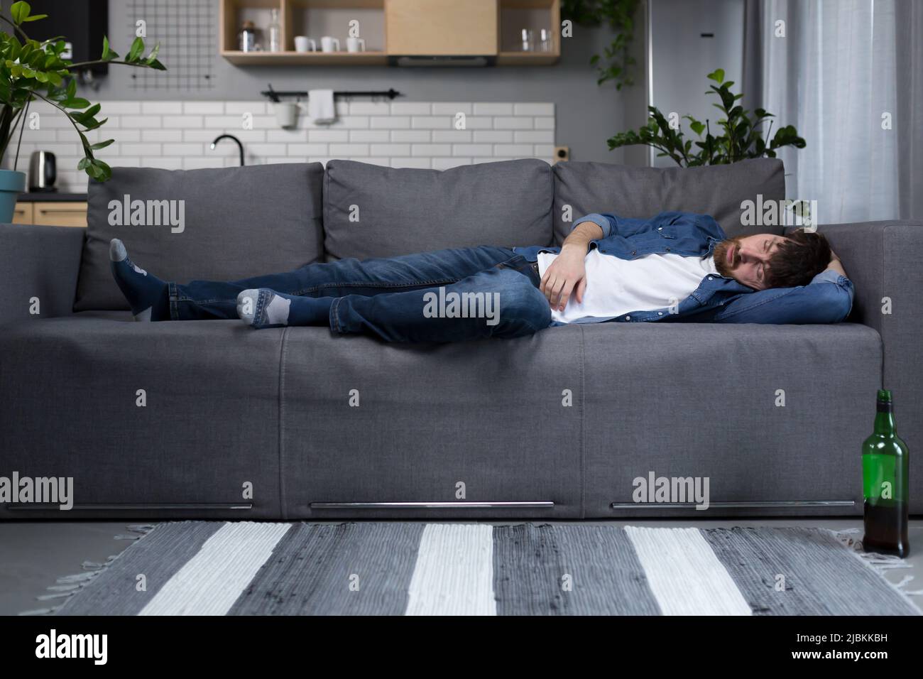 Man on floor drunk home hi-res stock photography and images - Alamy