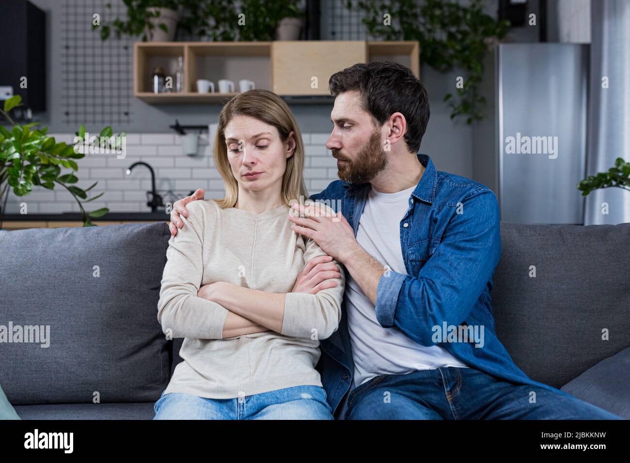 Sad man and woman hug hi-res stock photography and images - Alamy