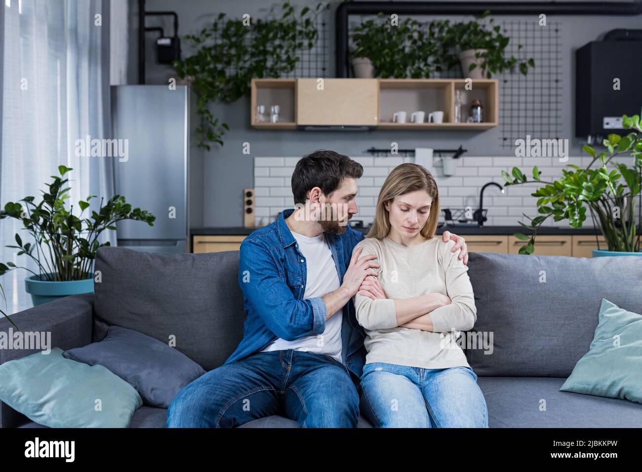A Man Tries To Support And Calm A Sad Woman A Married Couple Sitting