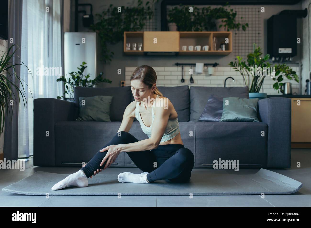 A woman injured her leg and knee at home during morning exercises ...