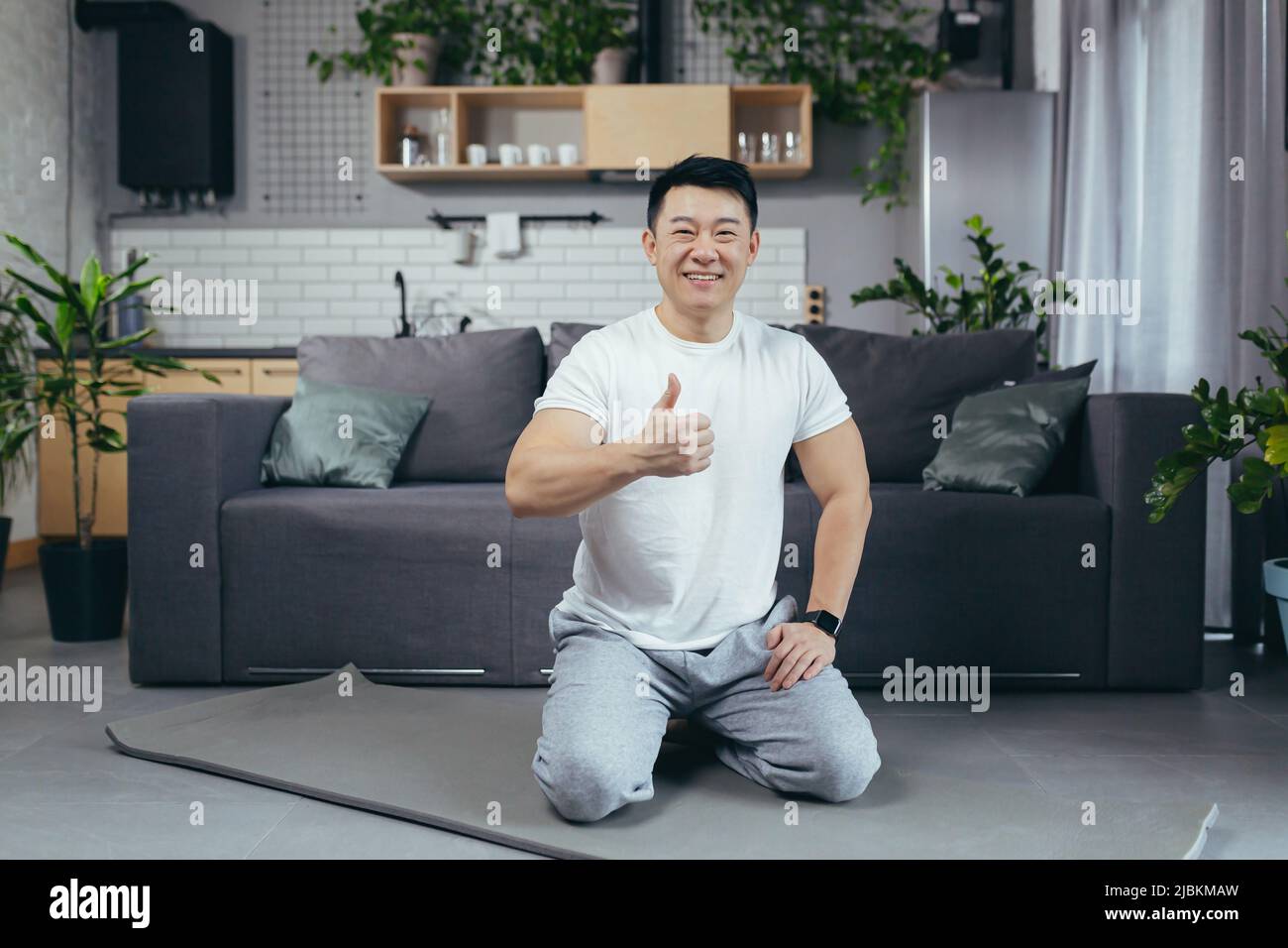 Young chinese man exercising gym hi-res stock photography and images ...