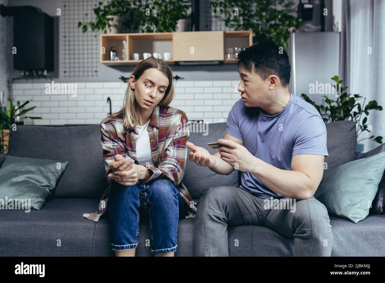 Asian man quarrels with his wife, accuses him of squandering family ...