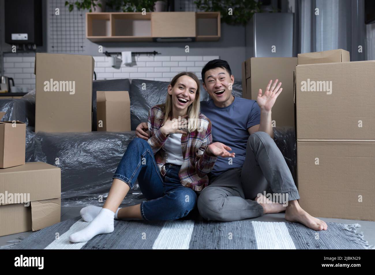 Chinese family waving hands together hi-res stock photography and ...