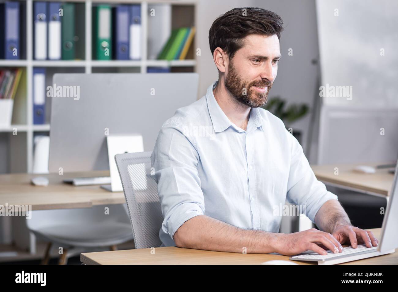 Real people businessman happy computer hi-res stock photography and ...