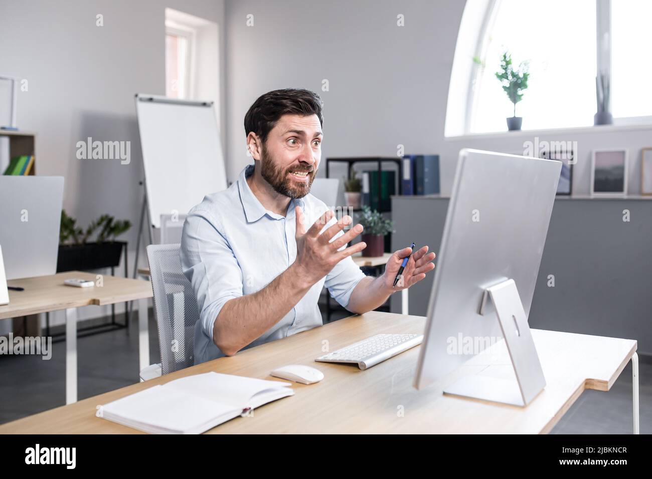Sad and anxious man working in the office, businessman frustrated by ...