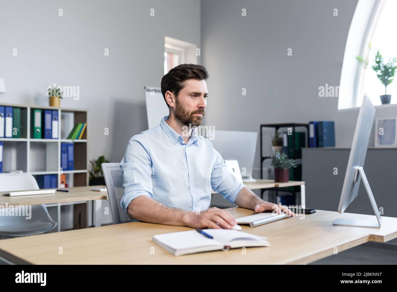 Man looks intently computer monitor hi-res stock photography and images ...