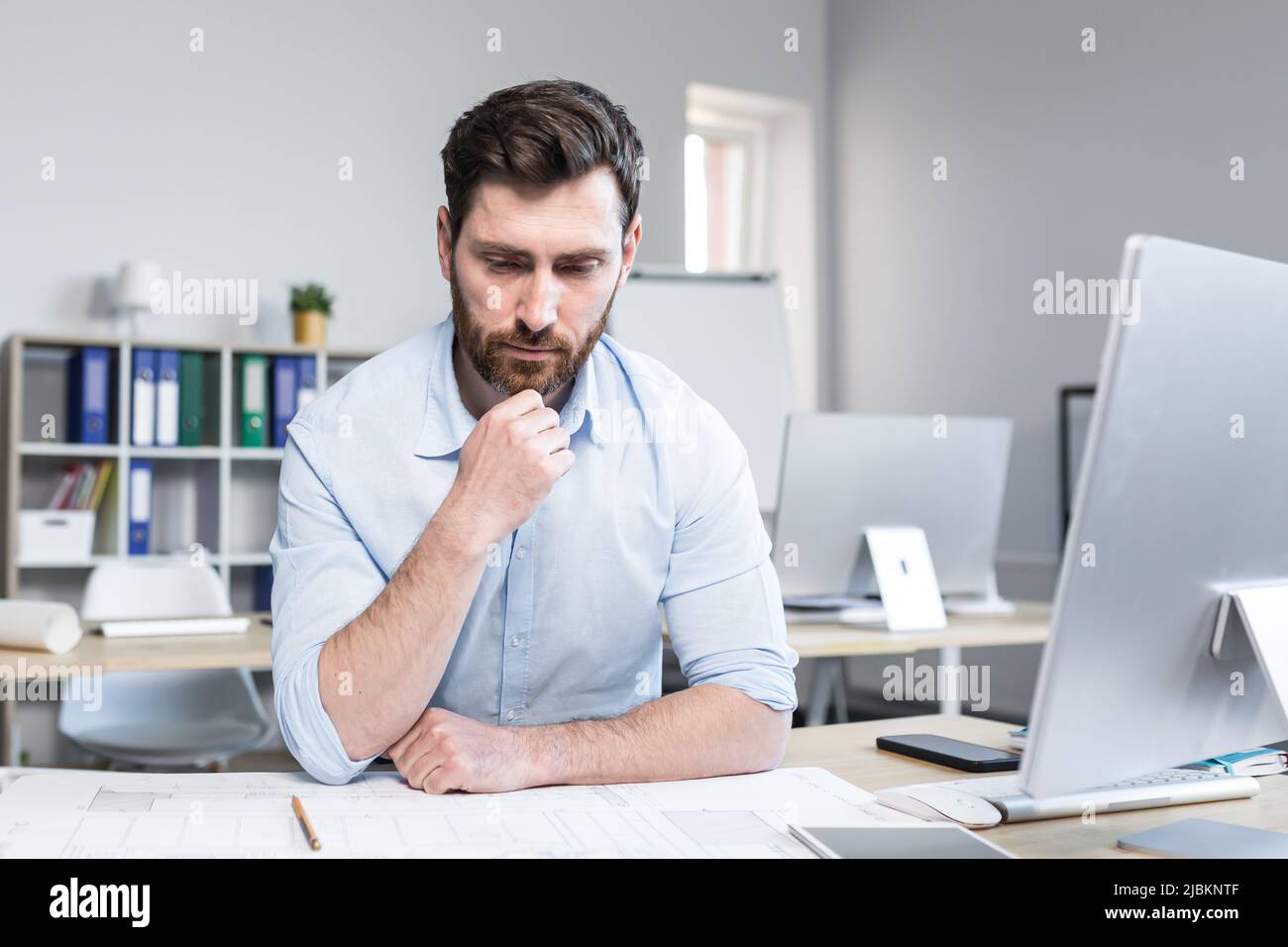 Businessman sitting desk making paper hi-res stock photography and ...