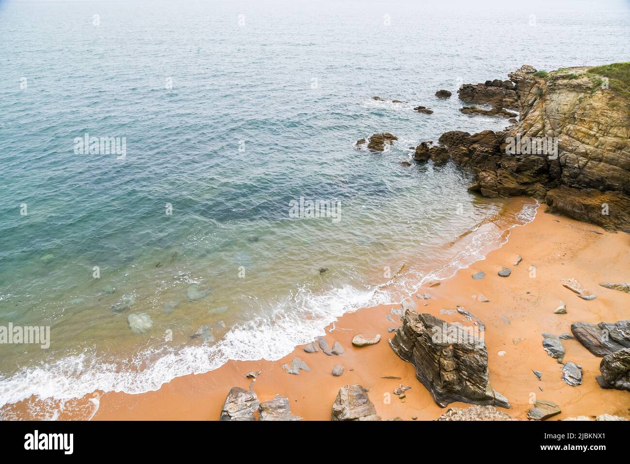Beautiful beach landscape with sand and rocks by the ocean. Sea ...