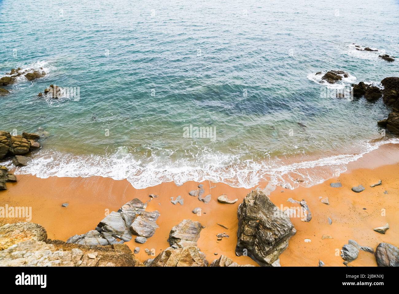 Beautiful beach landscape with sand and rocks by the ocean. Sea ...