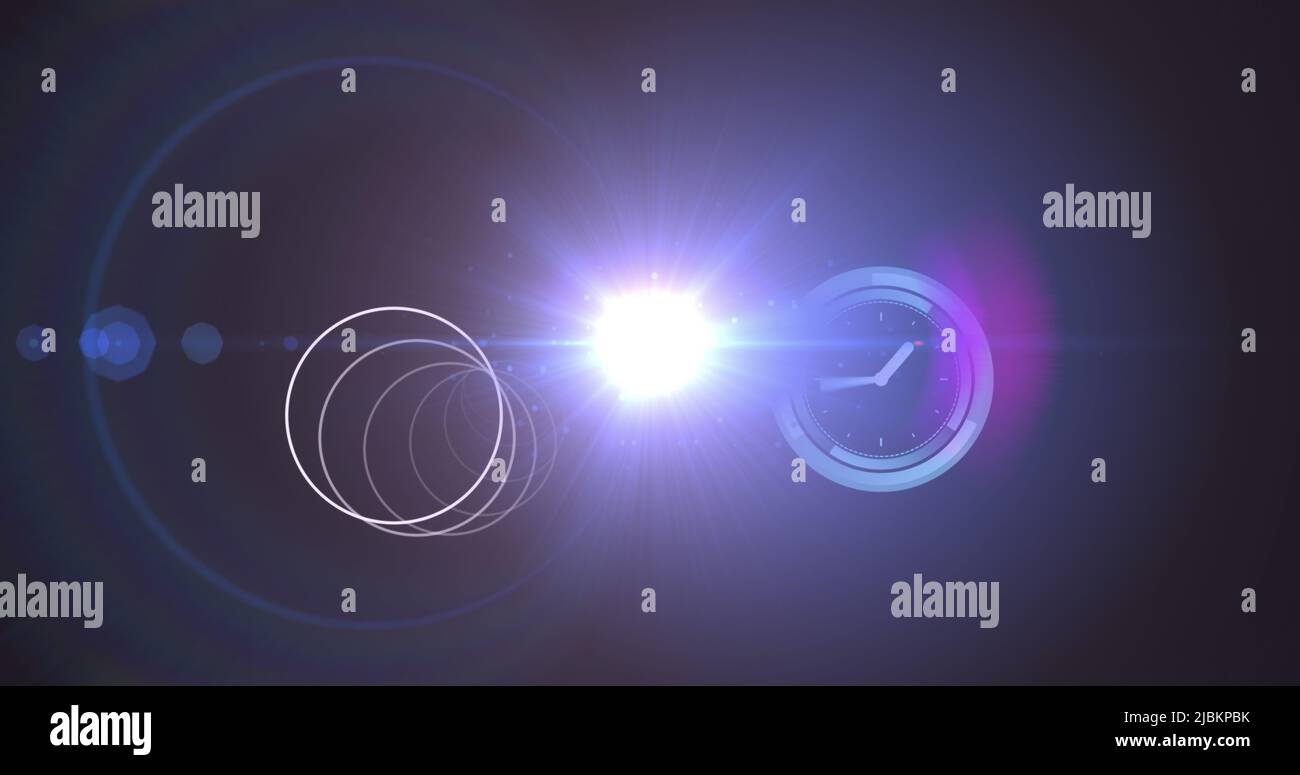 Image of clock over green glowing lights Stock Photo - Alamy