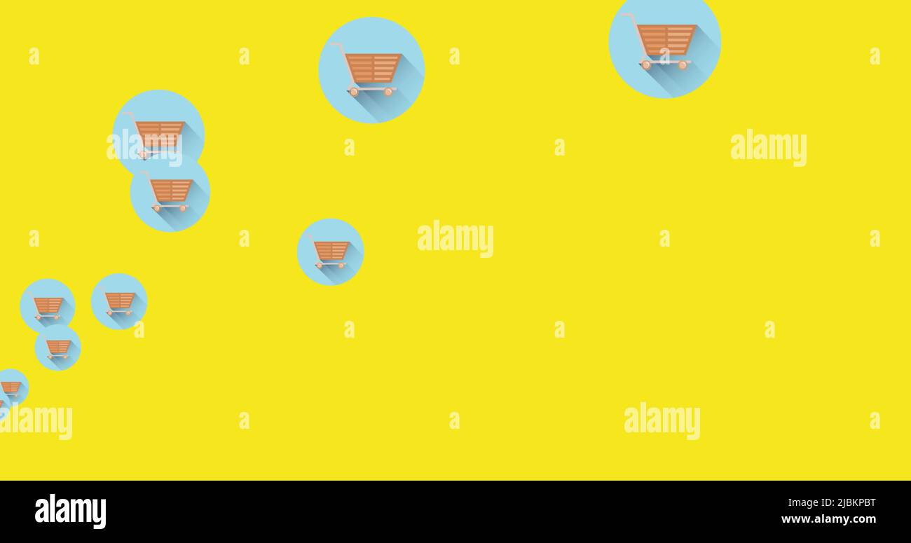 Image of falling shopping cart over yellow background Stock Photo - Alamy