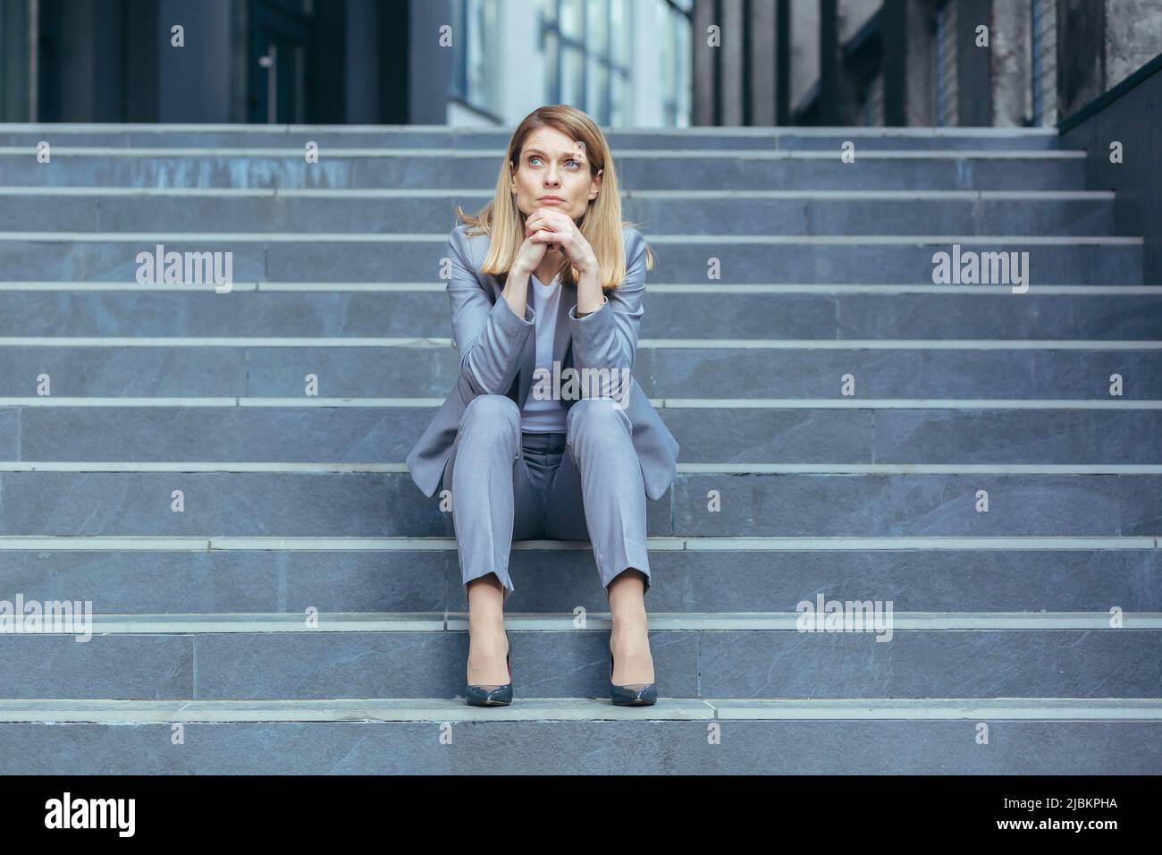 Woman cry stairs hi-res stock photography and images - Alamy