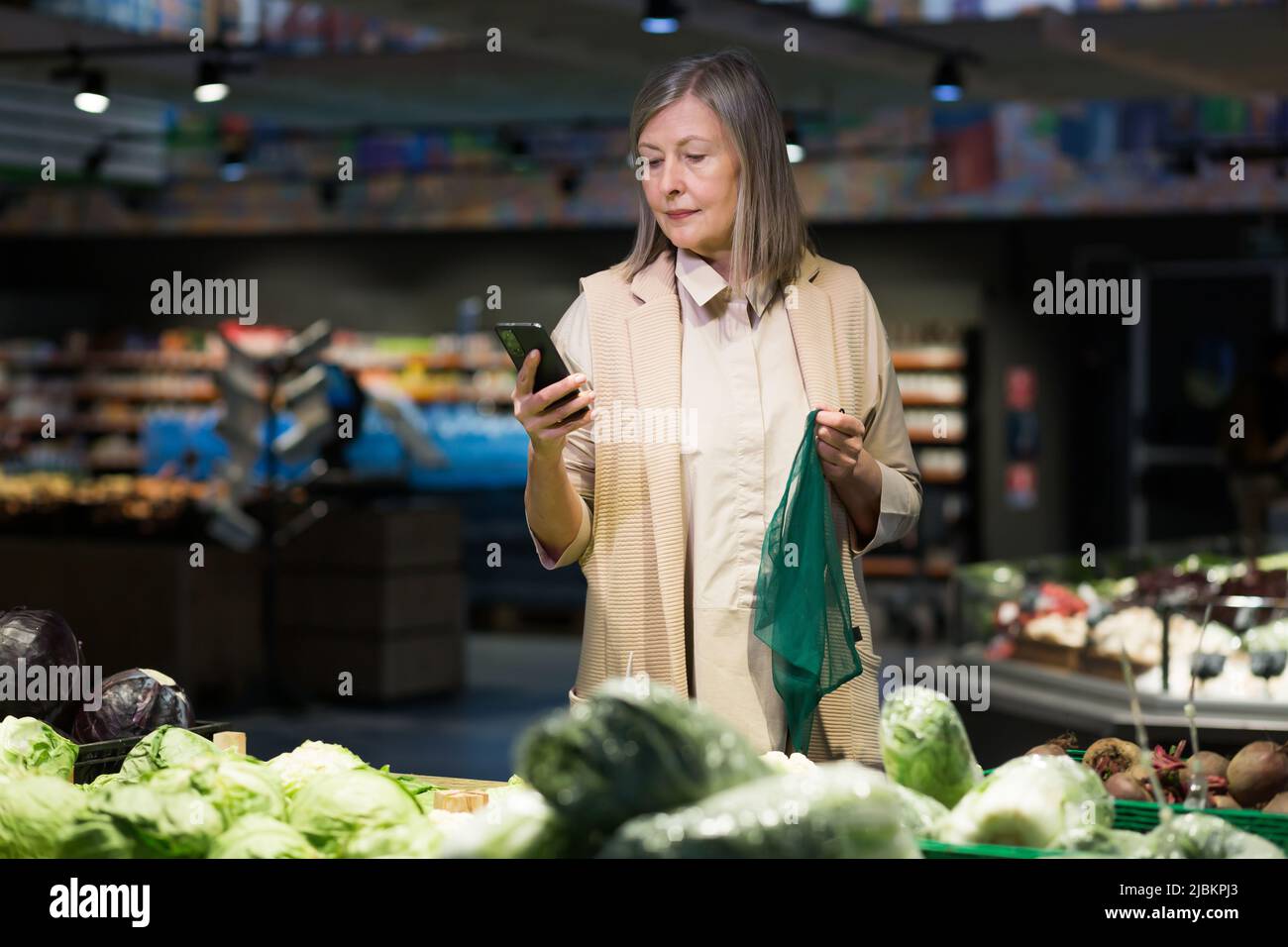 Senior grocery store produce hand hi-res stock photography and images ...