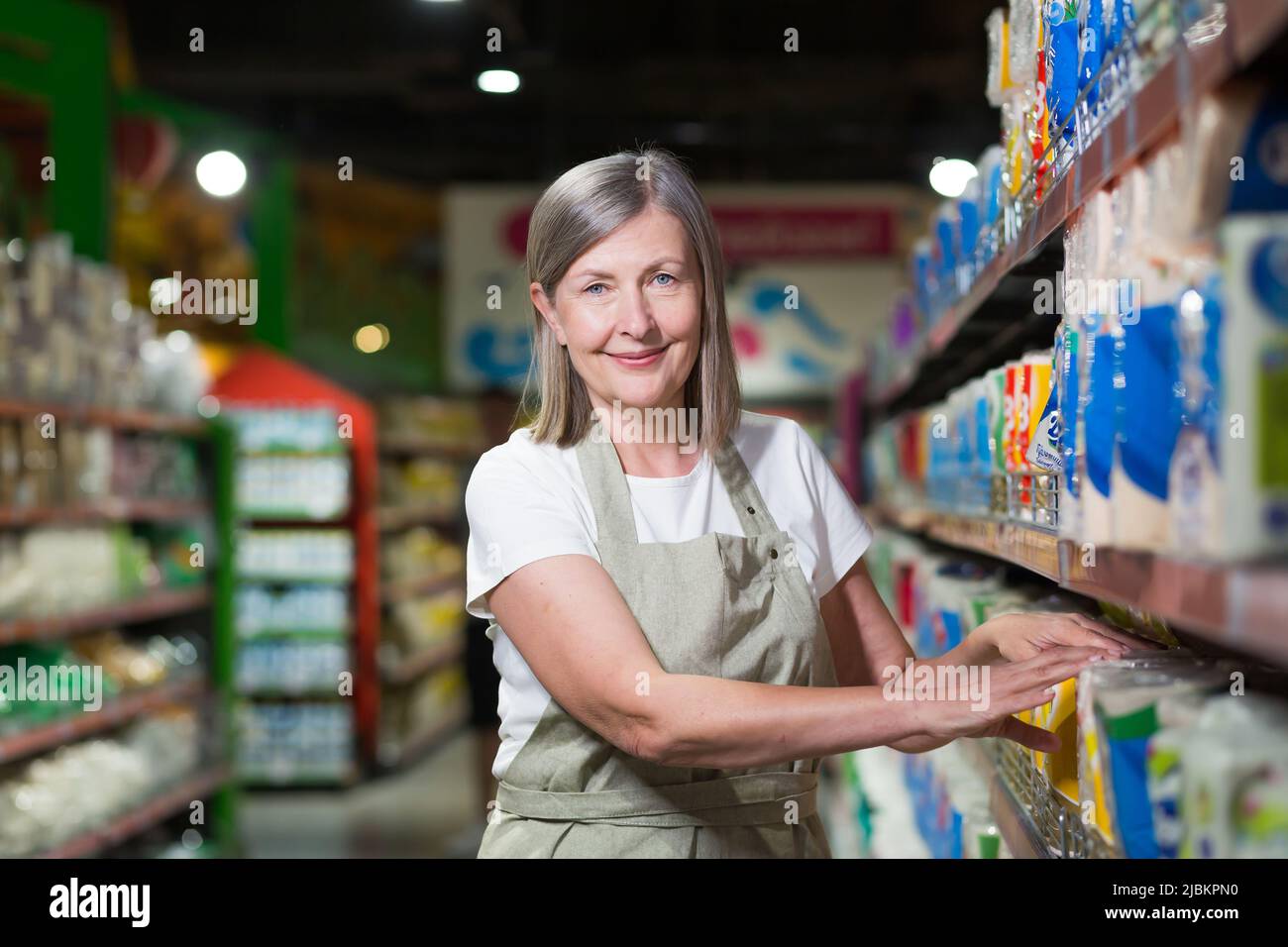 Older worker supermarket hi-res stock photography and images - Alamy
