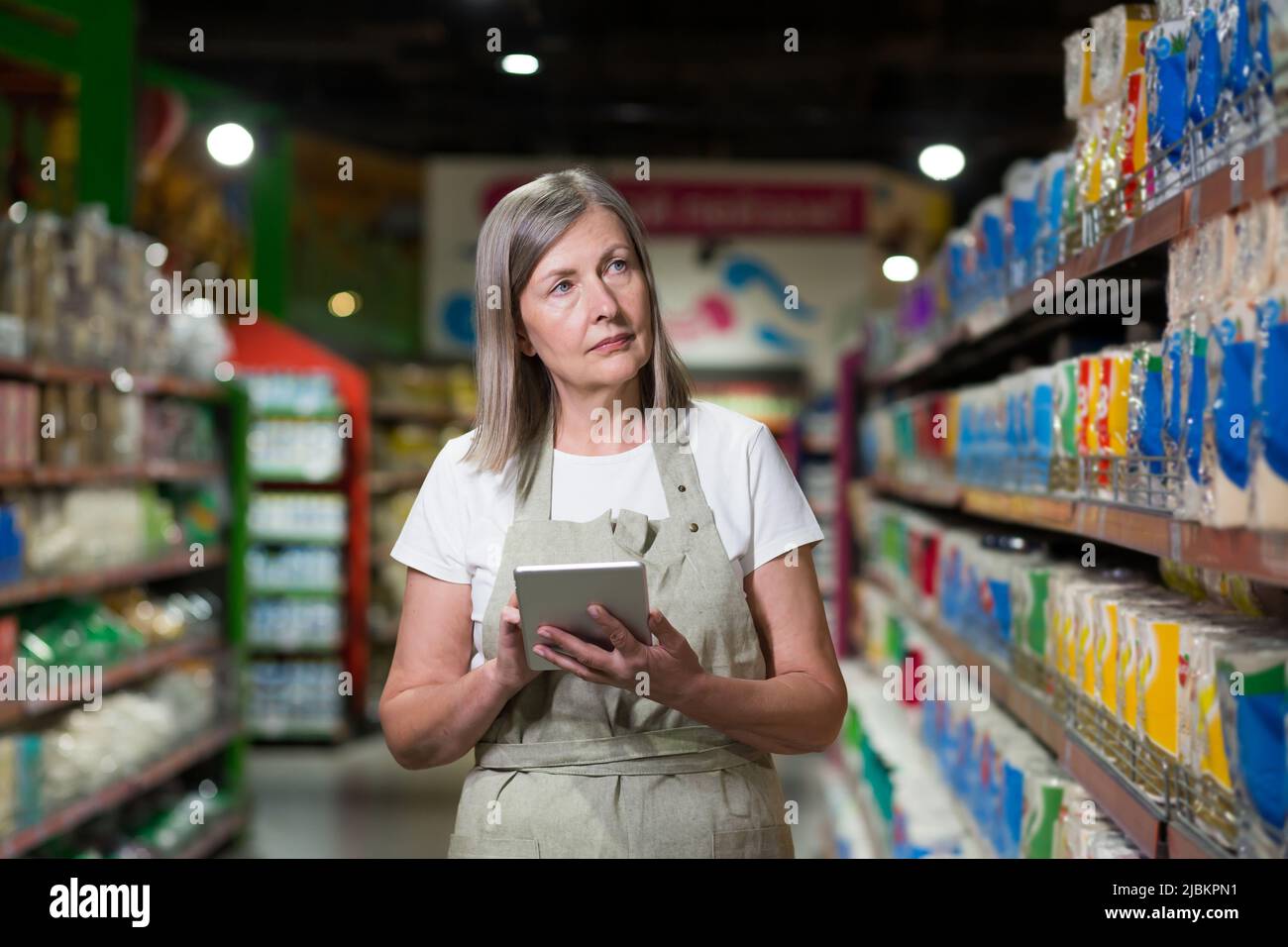 Elderly female salesperson hi-res stock photography and images - Alamy