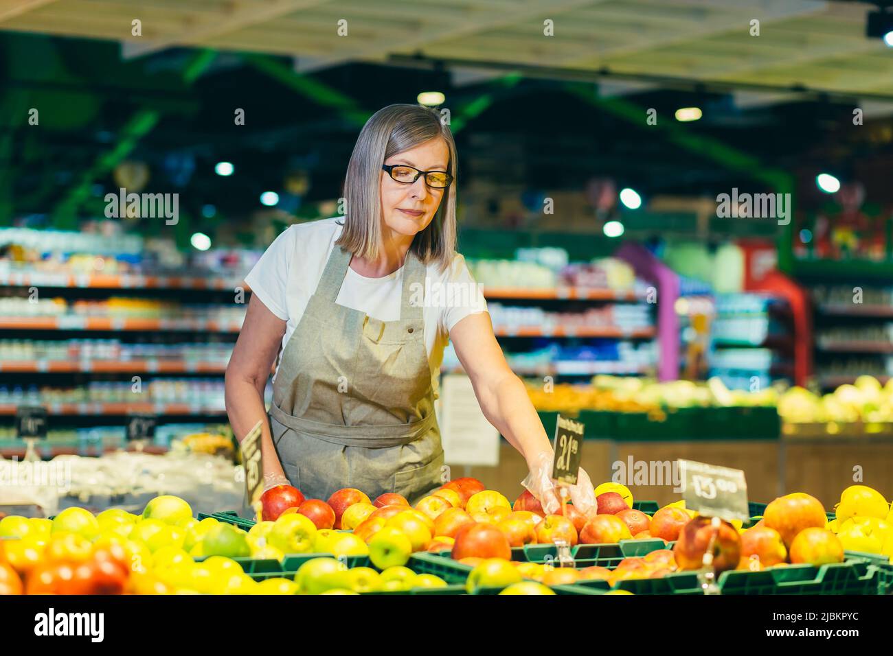 Female store worker hi-res stock photography and images - Alamy