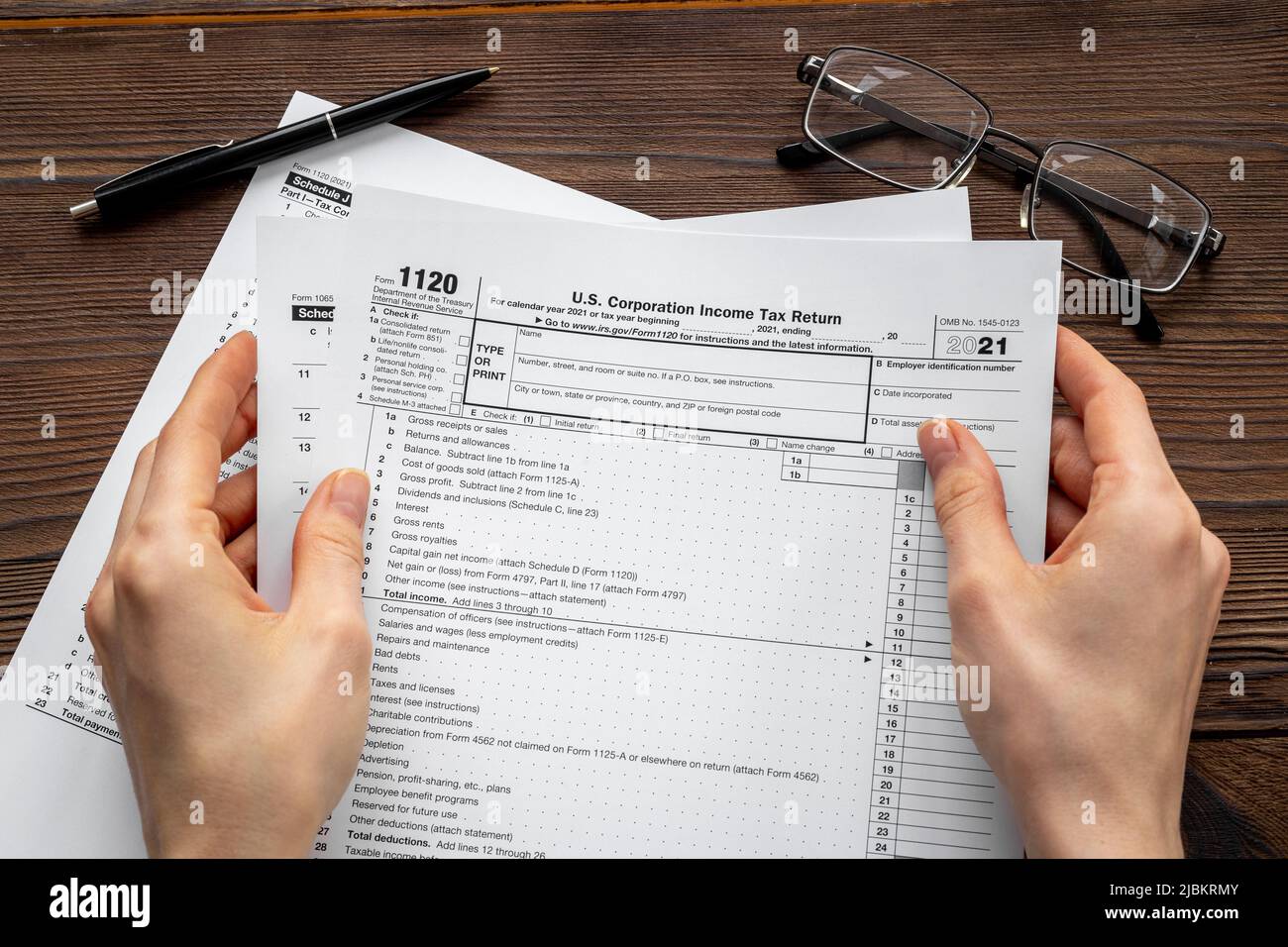 Accountant culculate taxes - US tax form on office table desktop Stock ...