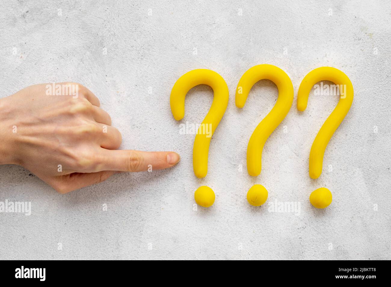 Hand points to question mark sign. Solving problem or search solution ...