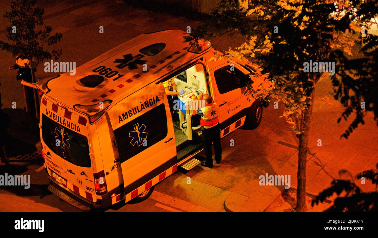 Ambulance attending a nocturnal emergency, Barcelona, Catalunya, Spain ...