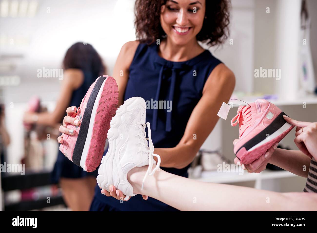 Women comparing size hi-res stock photography and images - Alamy