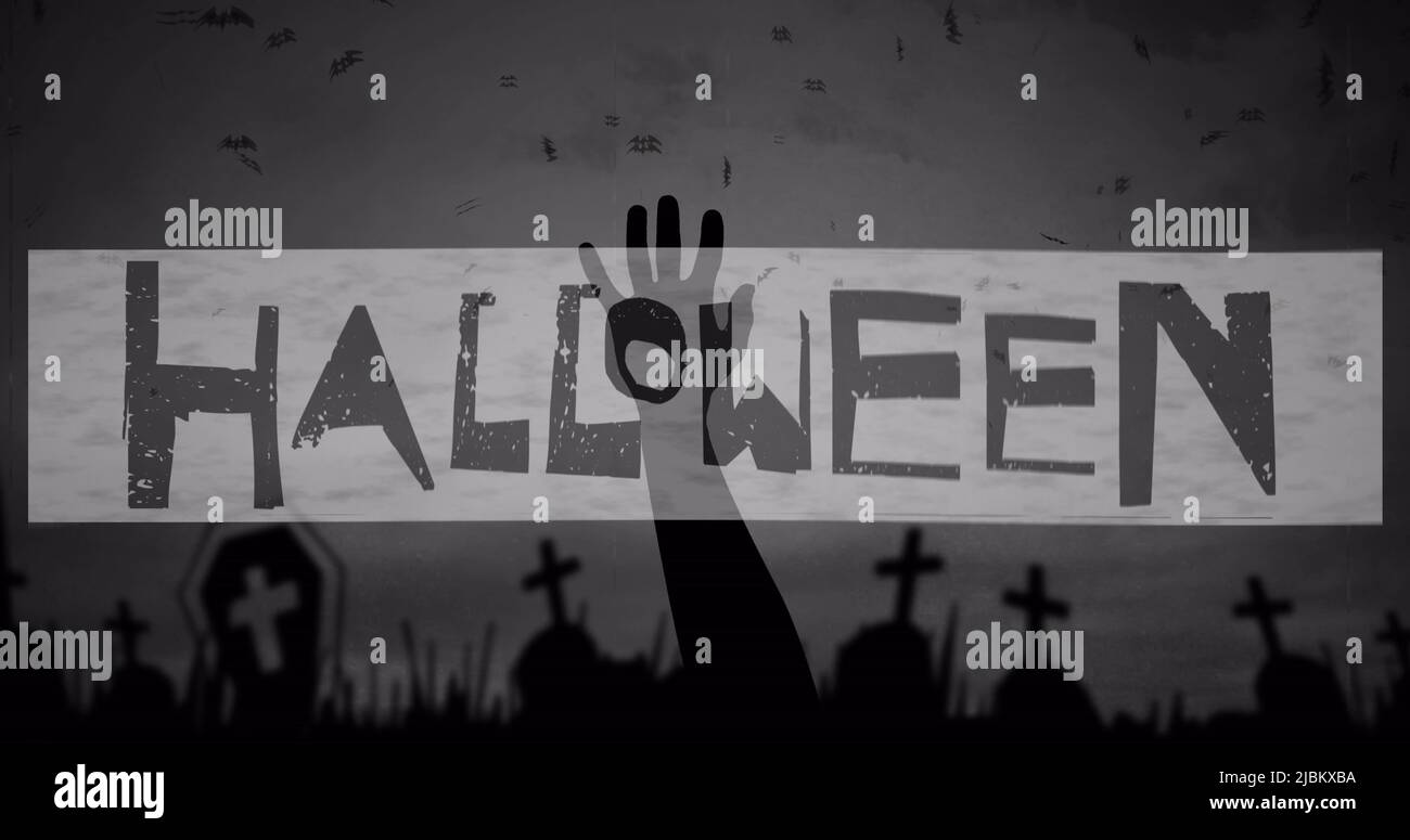 Digital image of happy halloween text banner against zombie hand coming ...