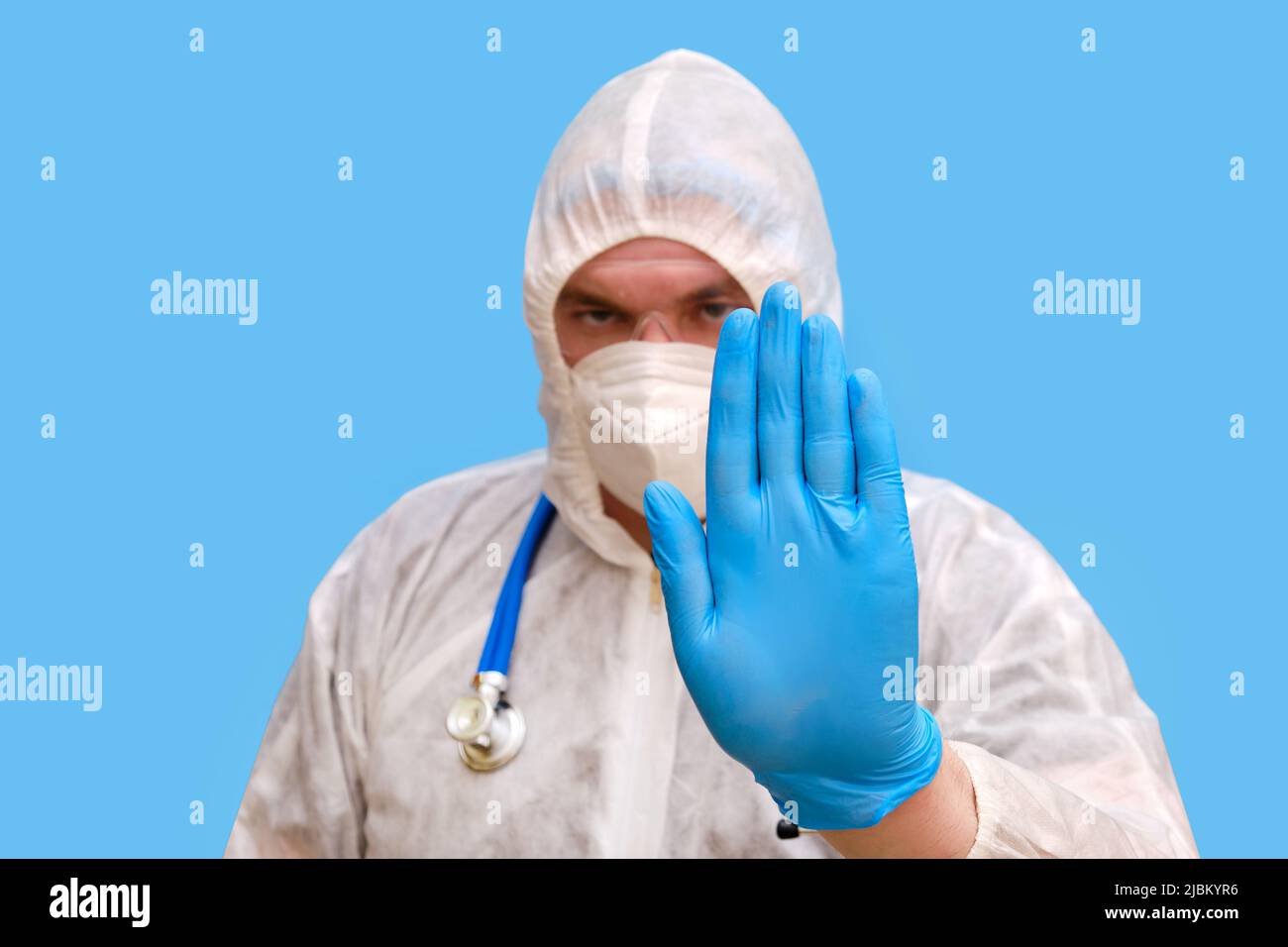 Man doctor medic in a protective suit uniform with goggles and face ...