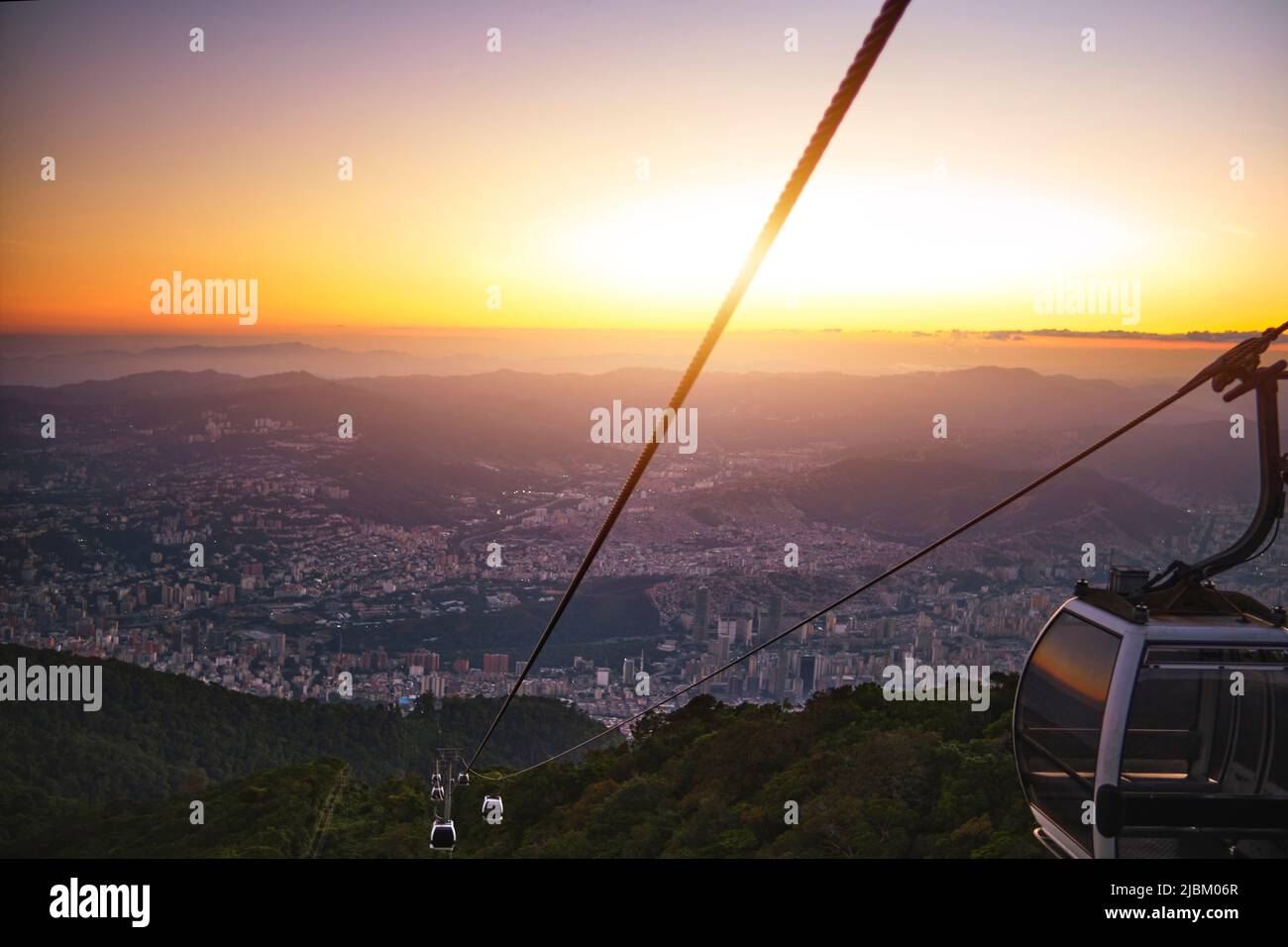 Modular cabins cable car against the bright sky, clouds ans mountains ...