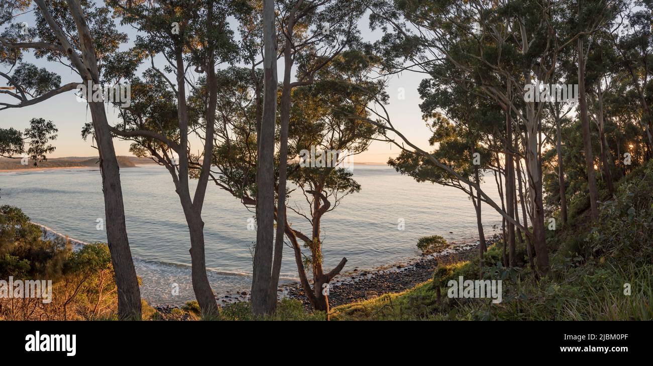 Looking down on Narrawallee Beach at dawn from Bannister Head Road ...