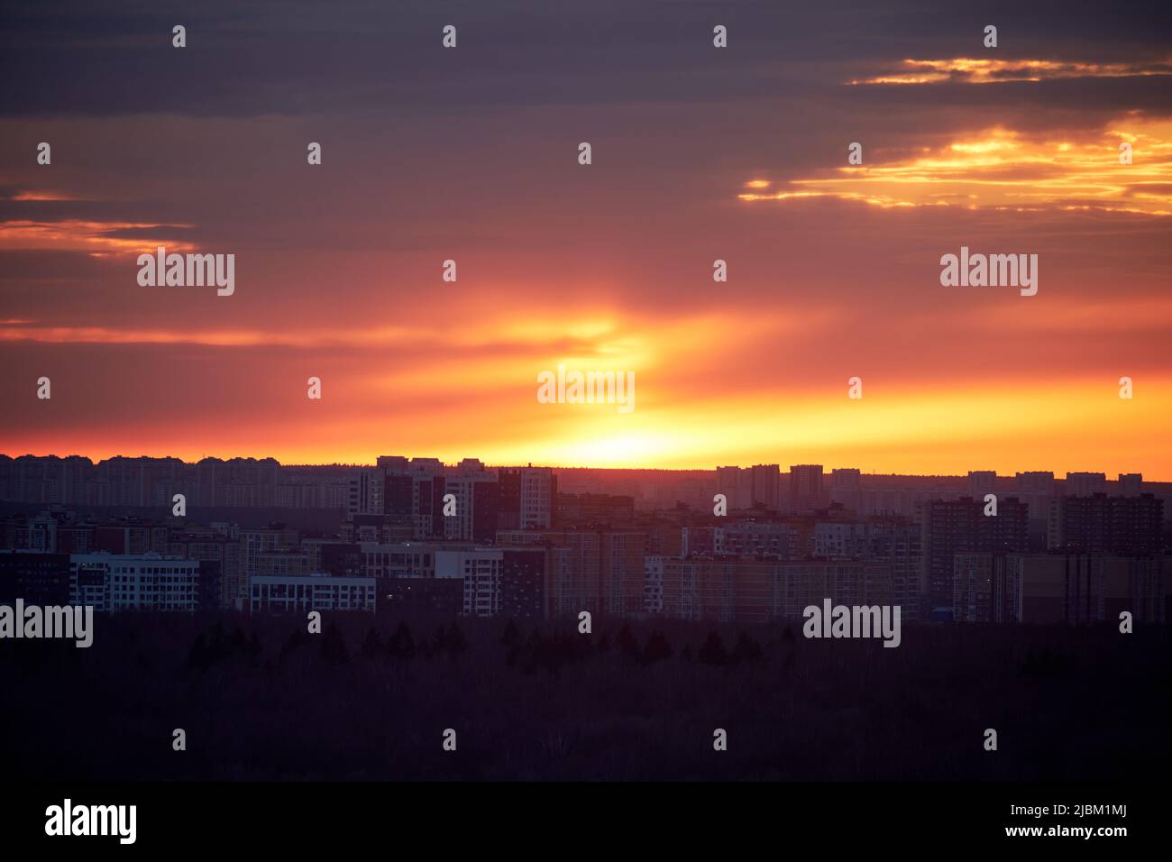 Morning sky at dawn with a large sun rising over the city, sunrise ...