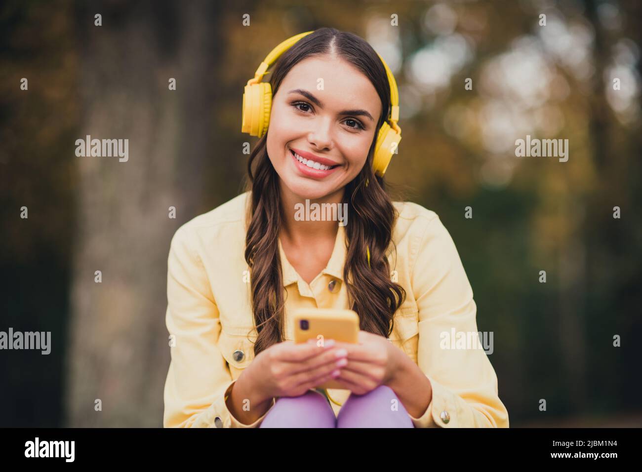 Portrait of beautiful trendy cheery girl listening song single melody ...