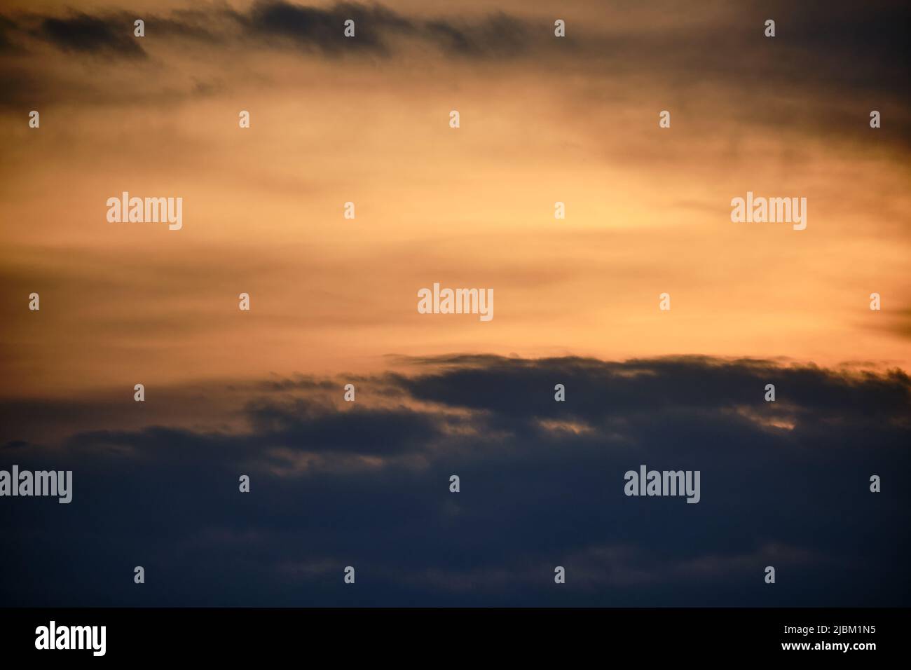 Evening dramatic sky with beige clouds during sunset Stock Photo - Alamy