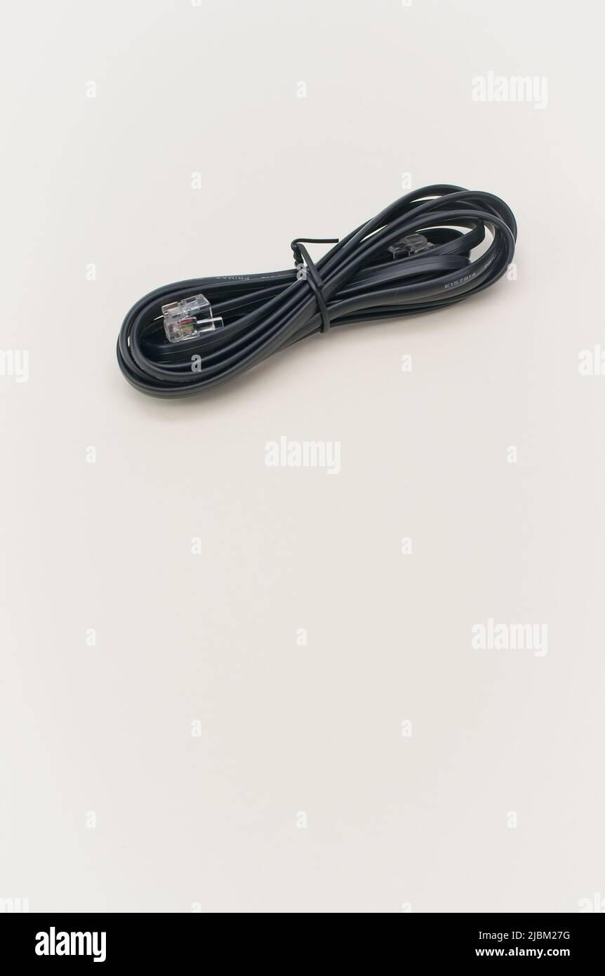 isolated data cable with RJ11 phone modem connector on a soft white ...