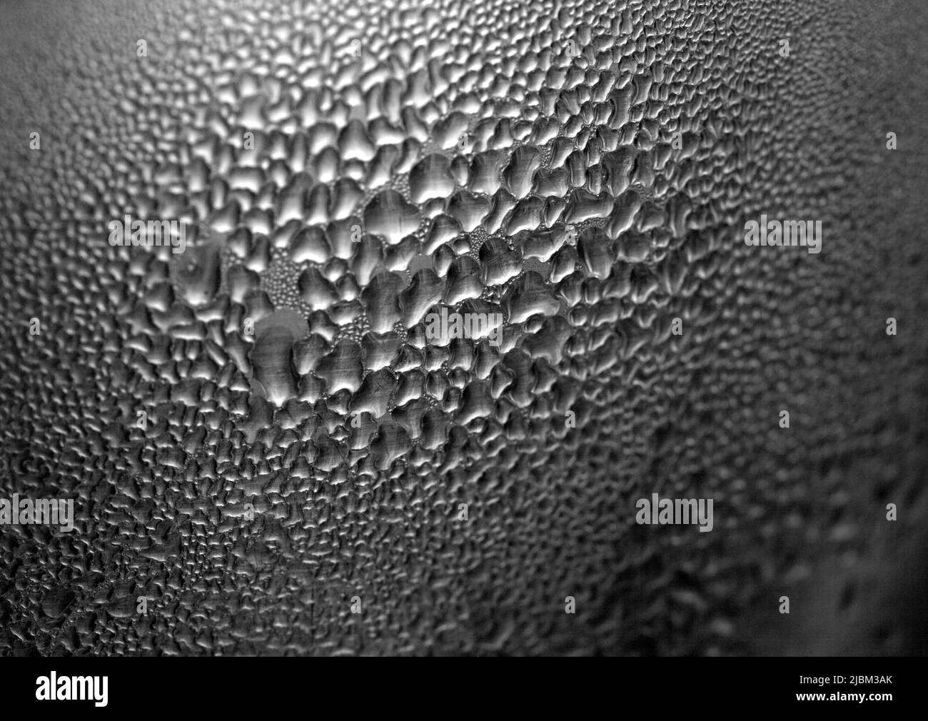 Macro background with water droplets condensation pattern on metal ...