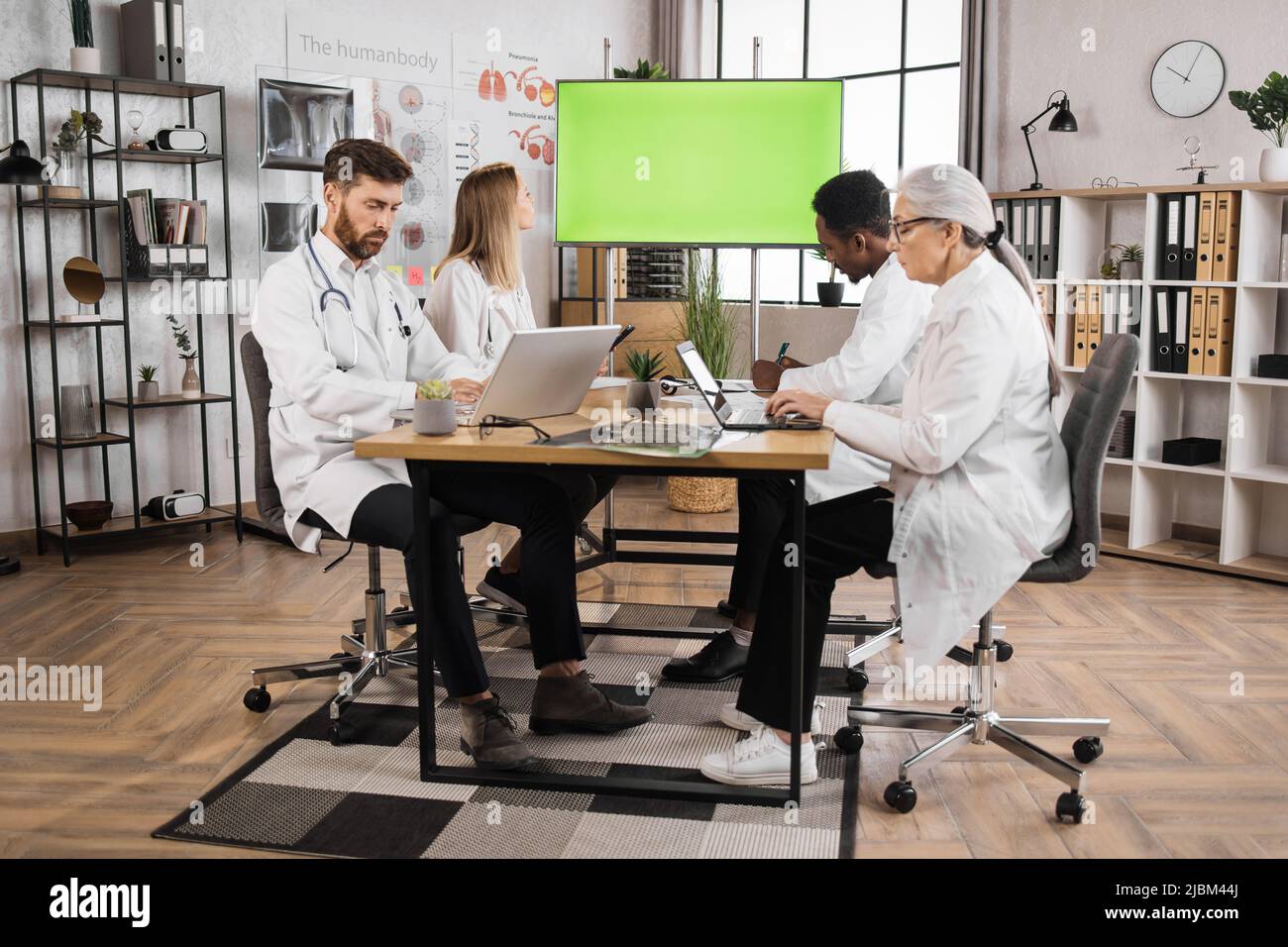 Team of multicultural medical specialists with thoughtful facial ...