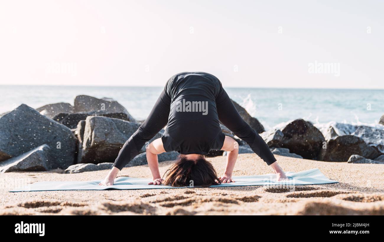 Standing forward bend pose hi-res stock photography and images - Alamy