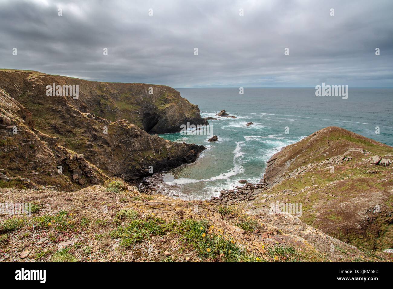 Pedngwinian Point, The Lizard, Cornwall taken under a cloudy sky at mid ...