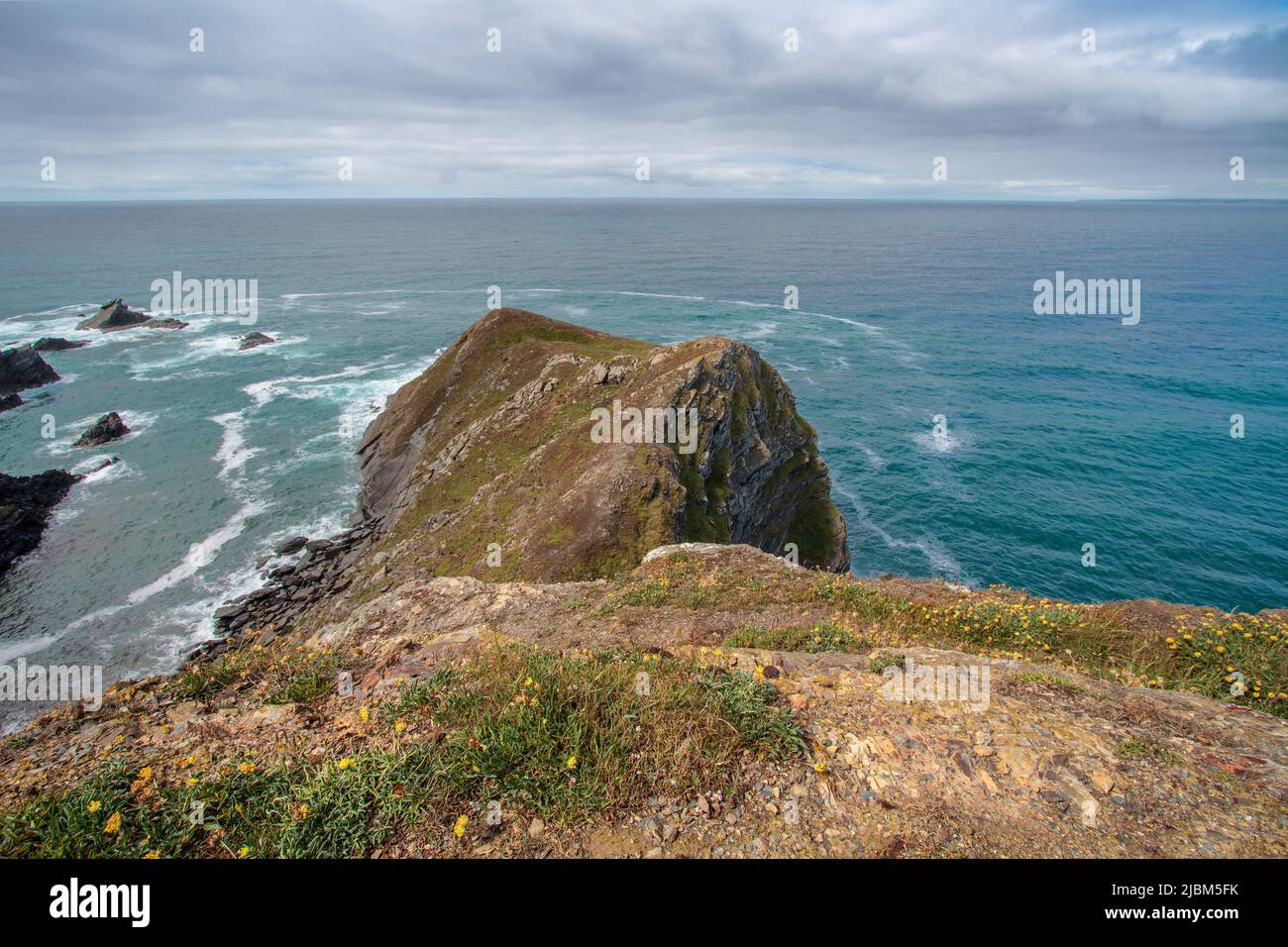 Pedngwinian Point, The Lizard, Cornwall taken under a cloudy sky at mid ...