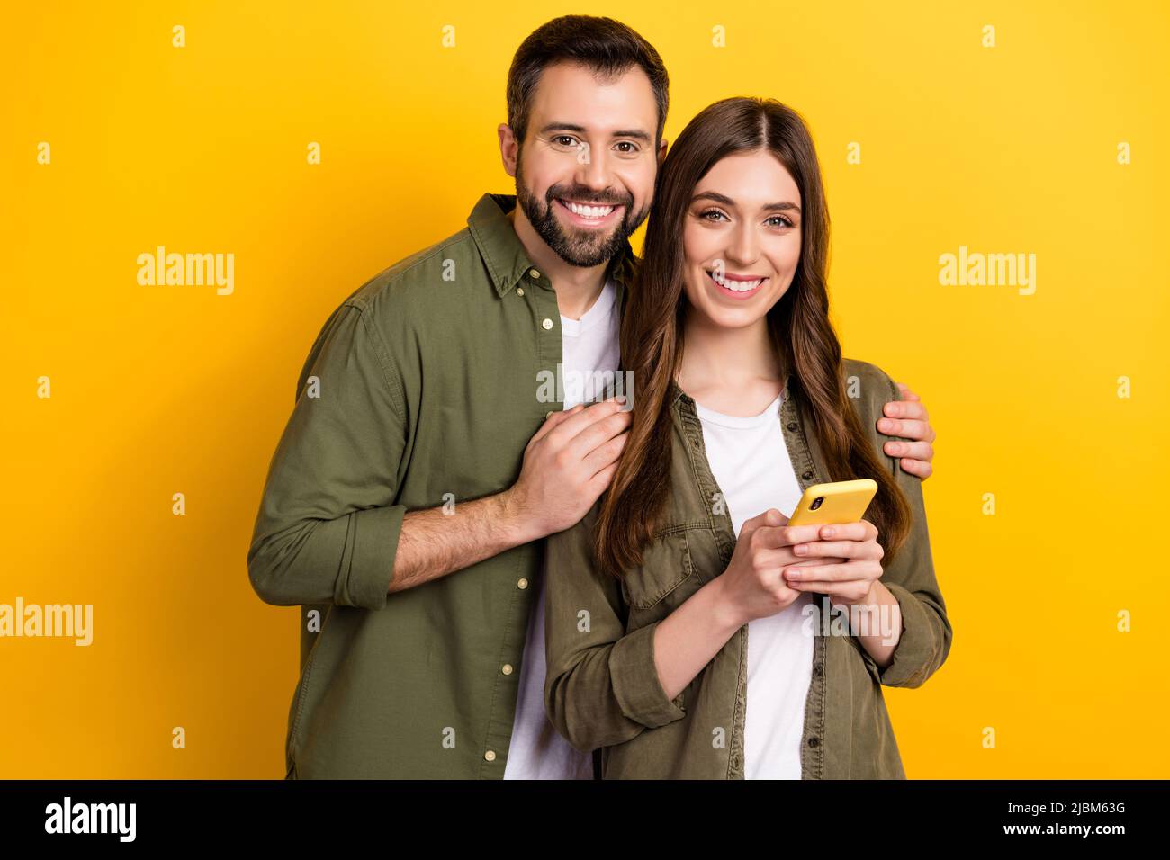 Portrait of attractive cheerful couple using device surfing web app 5g ...