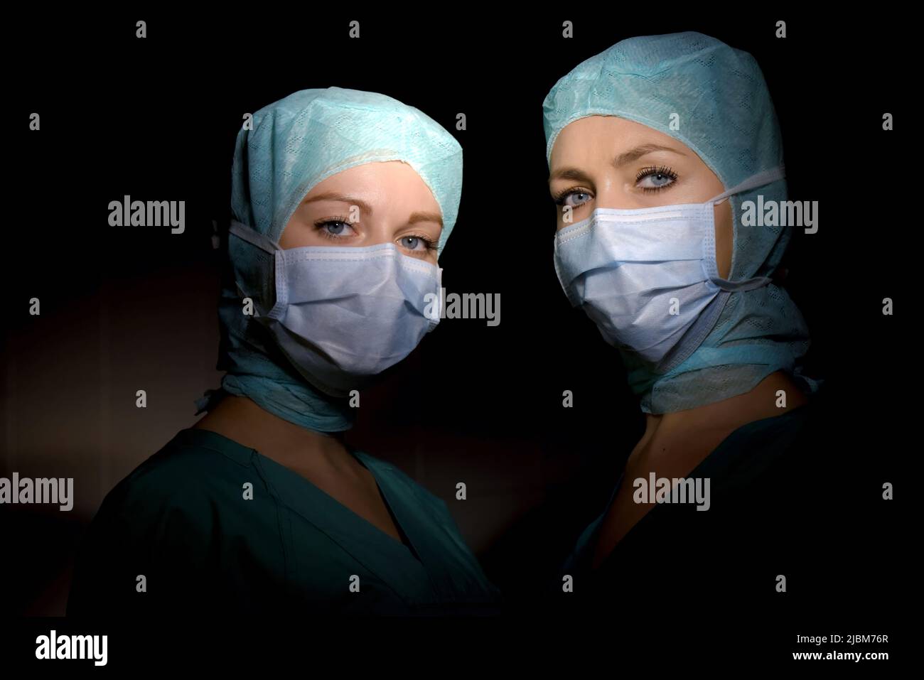 Two young women are seen in an operation theater dressed with medical ...