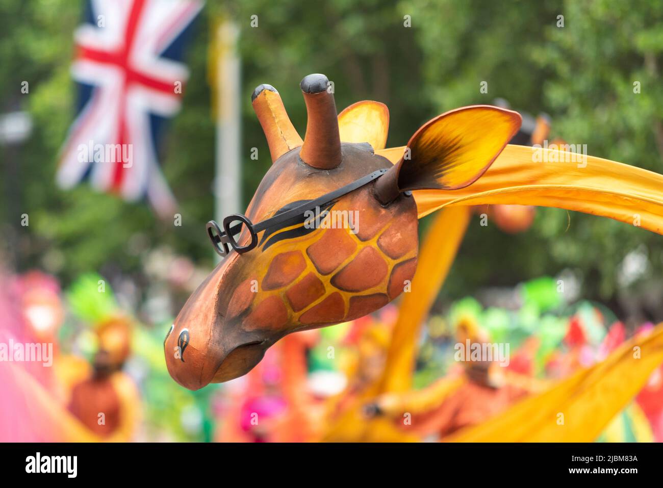 Large giraffe puppet at the Queen's Platinum Jubilee Pageant parade in ...